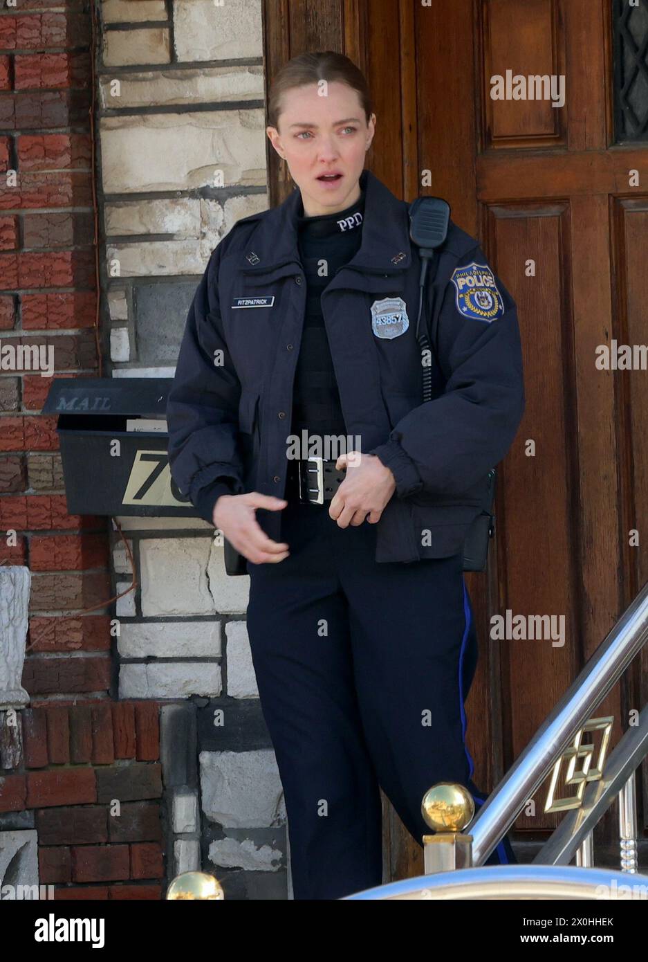Amanda Seyfried wearing a Philadelphia Police Uniform filming at the ...