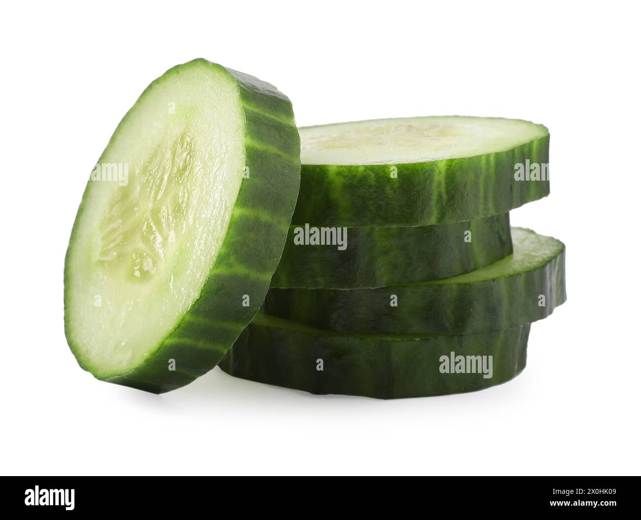 Stack of fresh cut cucumber isolated on white Stock Photo - Alamy