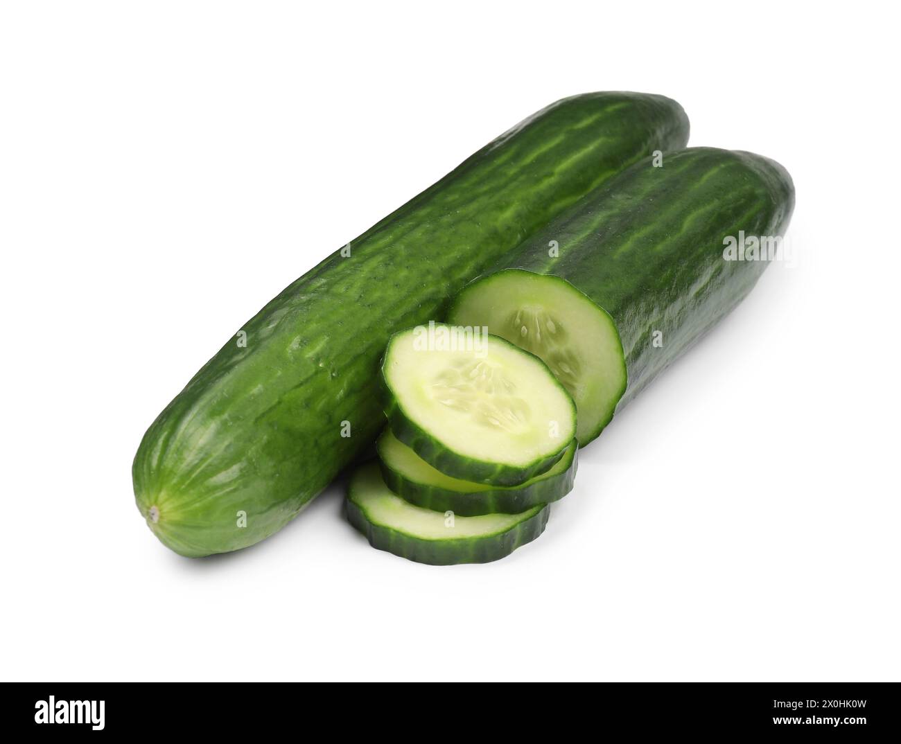 Whole and cut long cucumbers isolated on white Stock Photo - Alamy