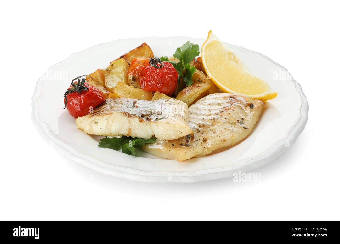 Tasty cod cooked with vegetables isolated on white Stock Photo - Alamy