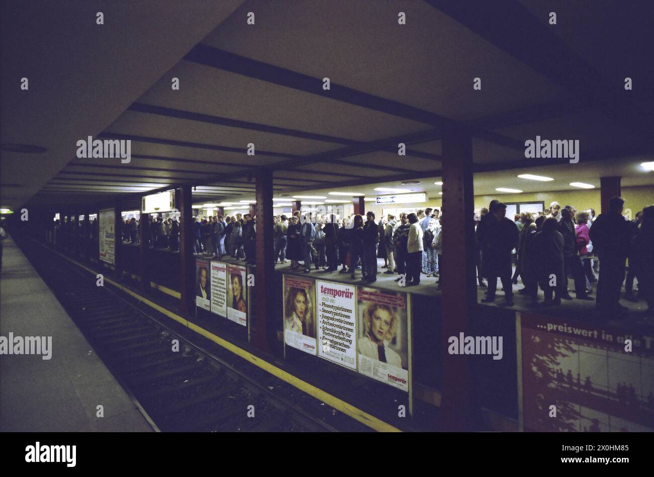A crowd of people waiting for the subway at Wittenbergplatz station ...
