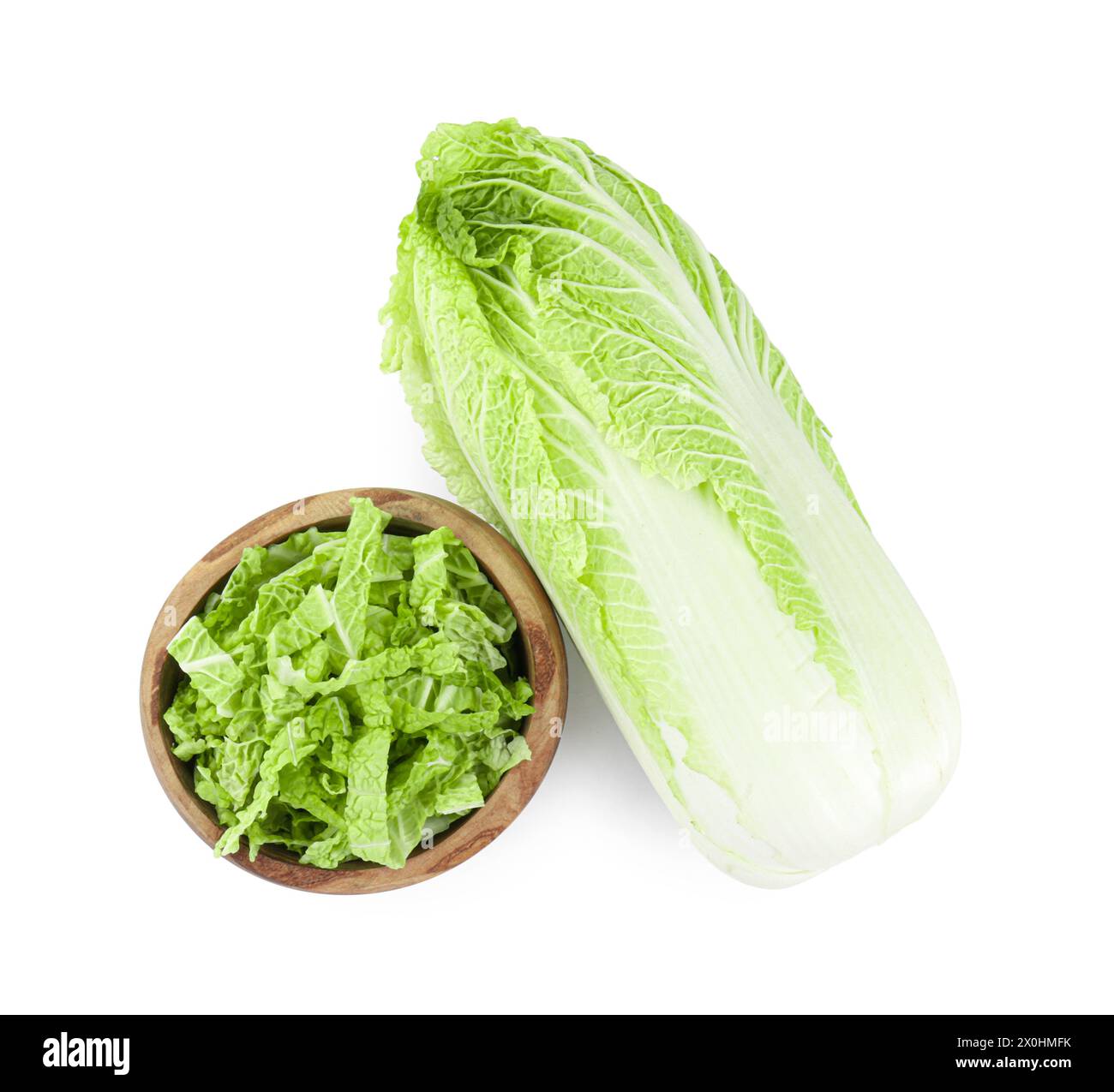 Shredded fresh Chinese cabbage in bowl and whole one isolated on white ...