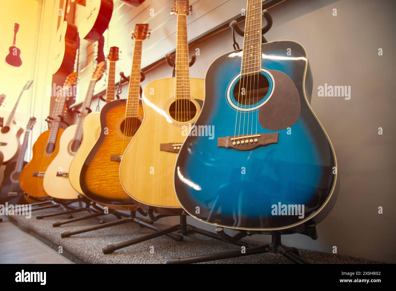 Guitars on sale. Stack of musical instruments Stock Photo - Alamy