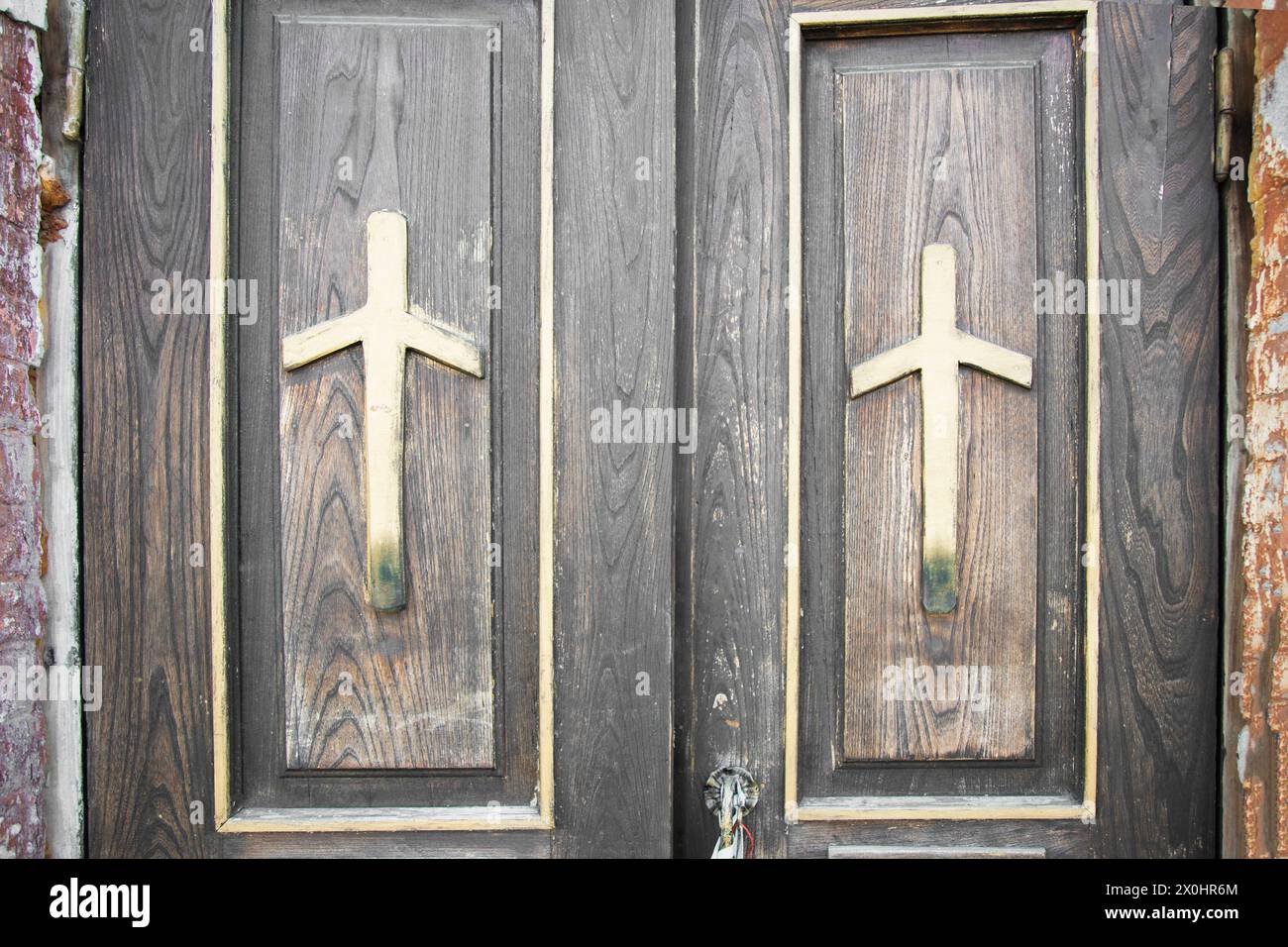 Cross of Saint Nino on wooden door . Close up . Georgian Christian ...