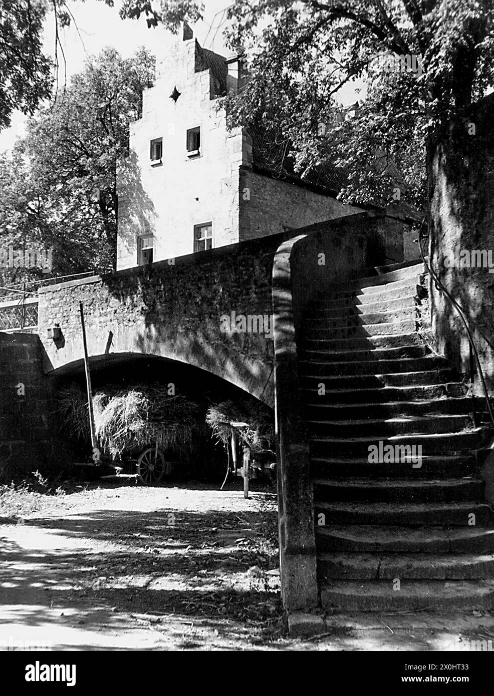 Hay wagon under the bridge, then still with stairs [automated ...
