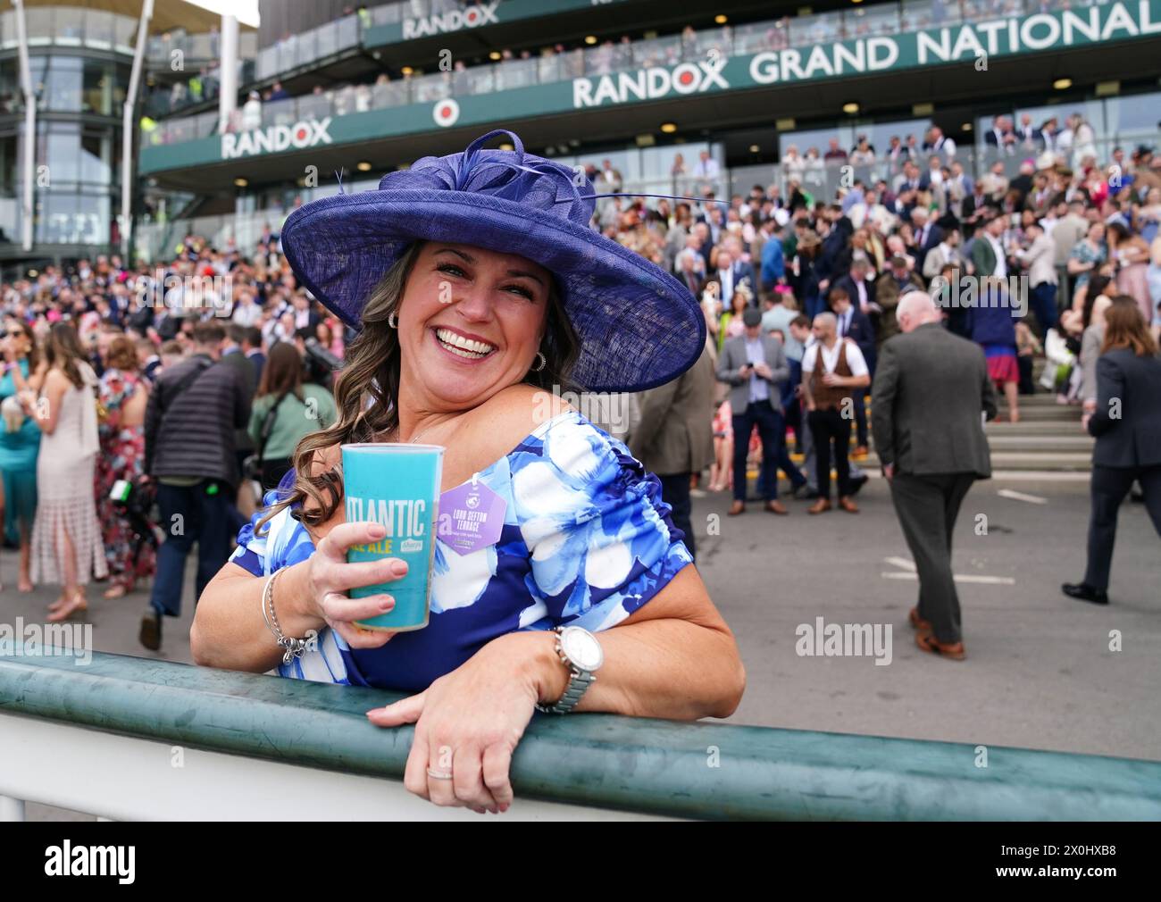 A racegoer in the stands on day two of the 2024 Randox Grand National ...