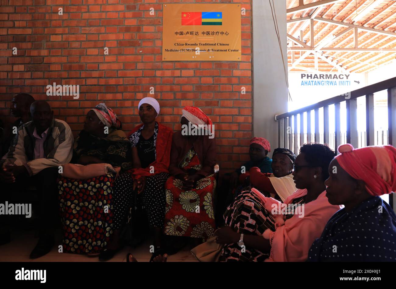 Kigali, Rwanda. 9th Apr, 2024. Patients wait outside the Traditional ...