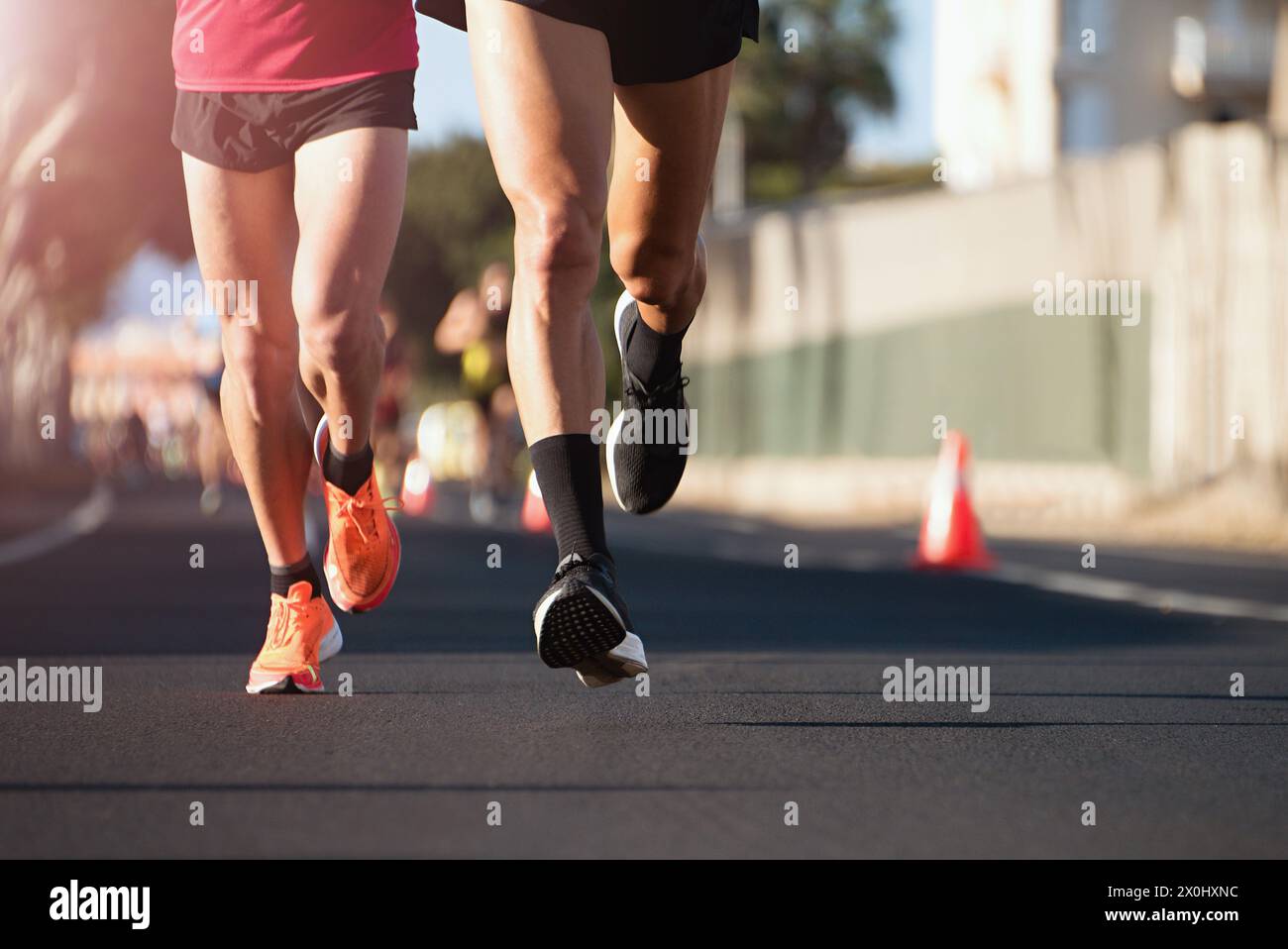 Marathon running in the light of morning. People feet on city road ...