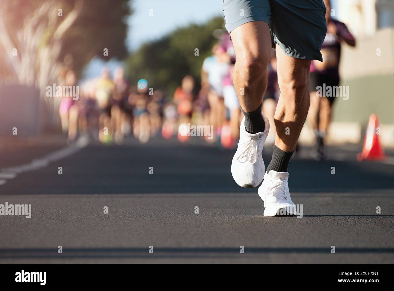 Marathon running in the light of morning. People feet on city road ...