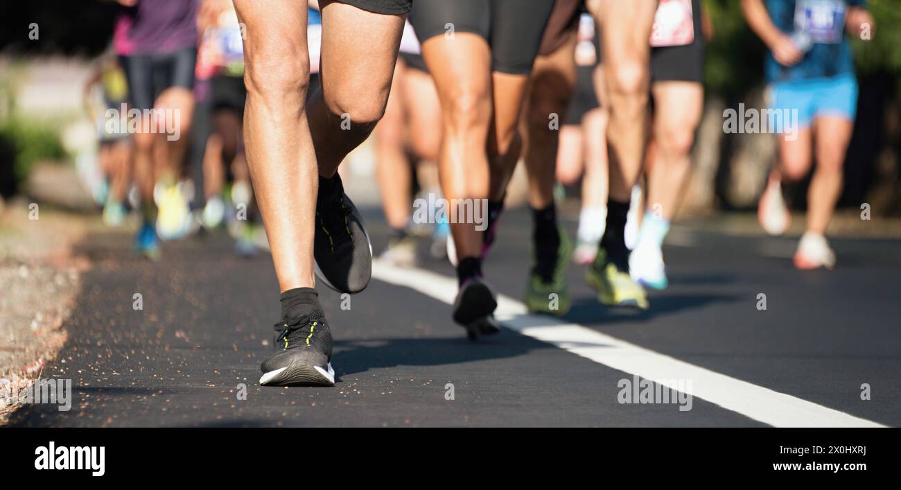 Marathon running race, people feet on city road Stock Photo - Alamy