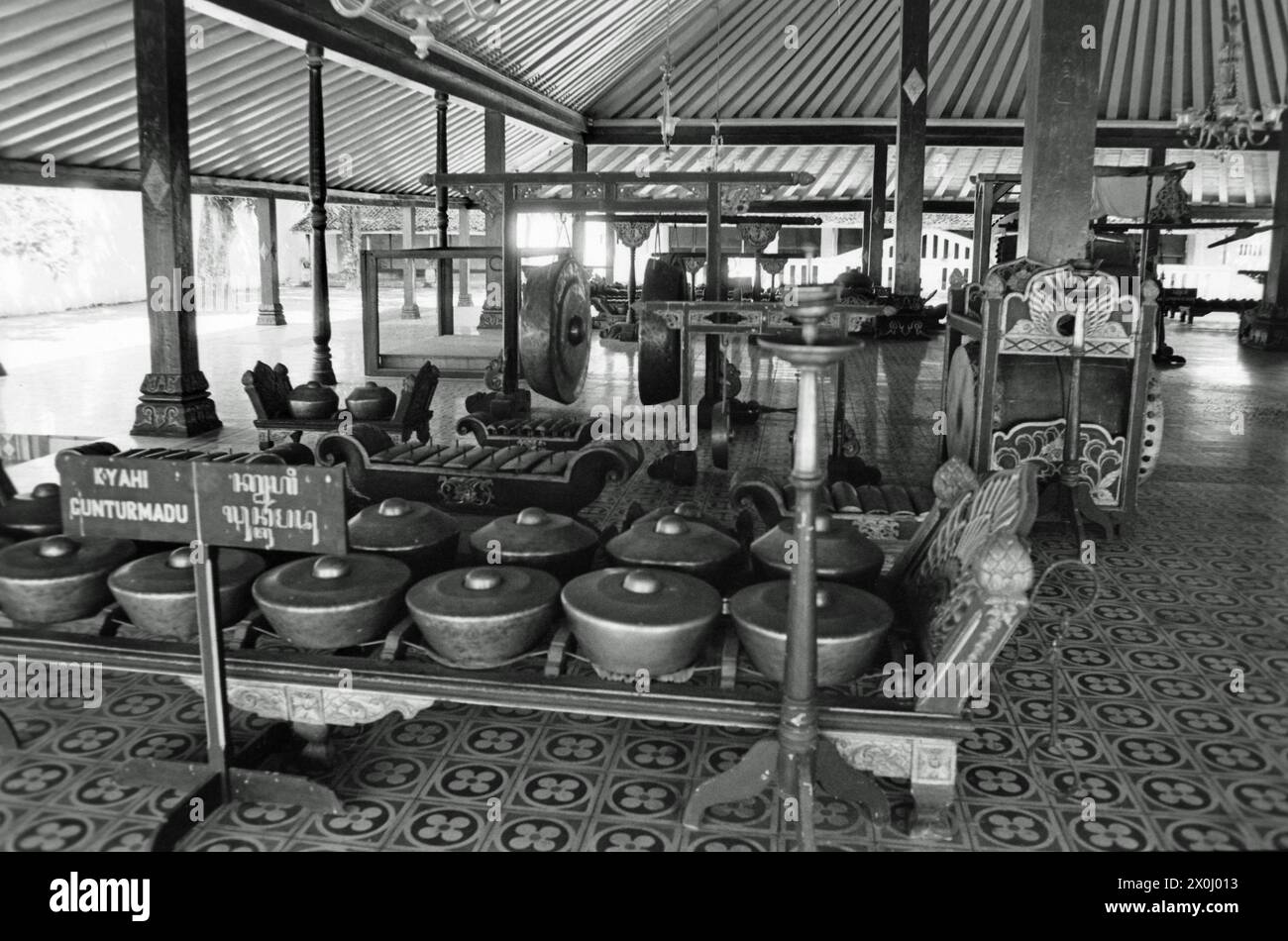 The various instruments of a gamelan ensemble are located in an open ...
