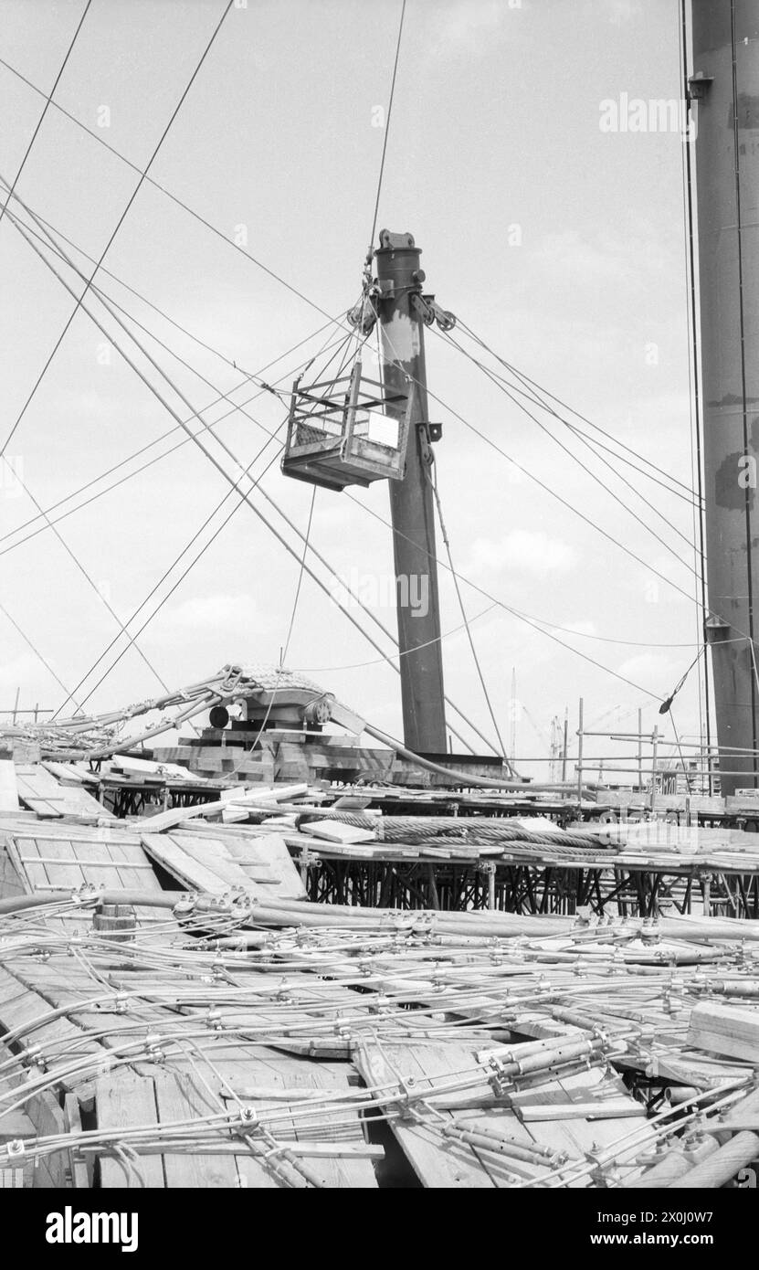 A working platform is transported on the suspension ropes. [automated ...