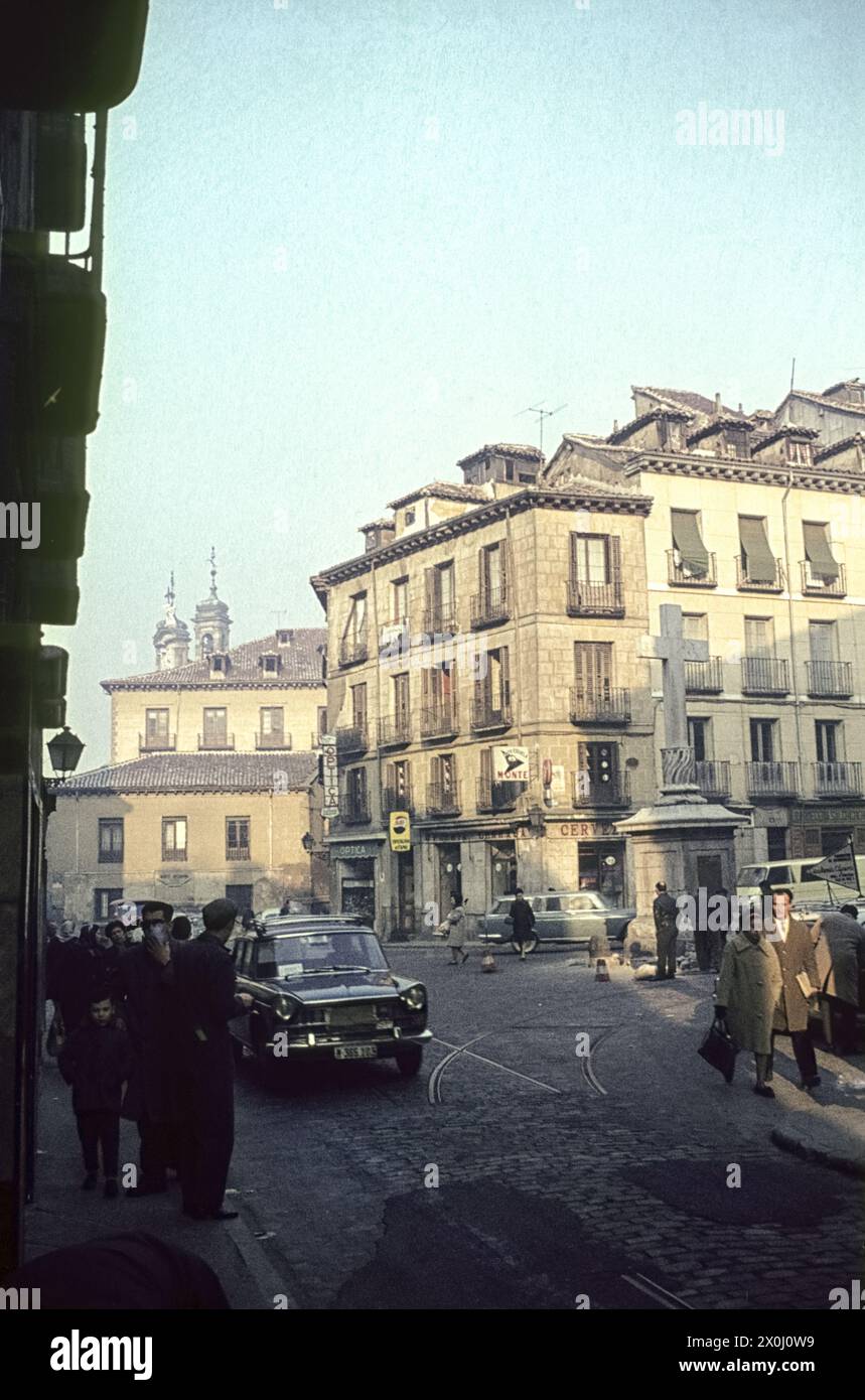 Lively square at the intersection with Calle de Cuchilleros. A monument ...