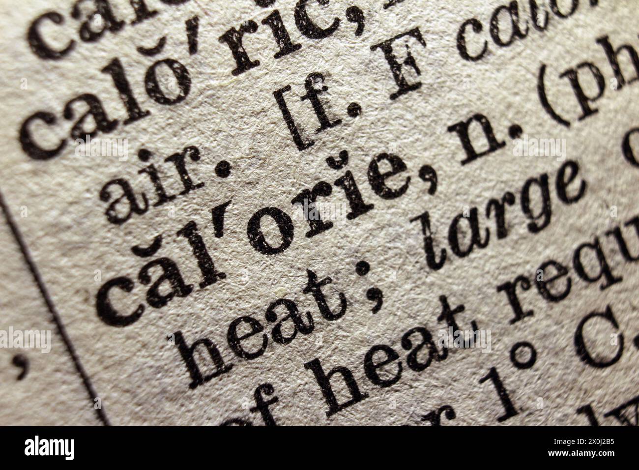 Word calorie on dictionary page, macro close-up Stock Photo - Alamy