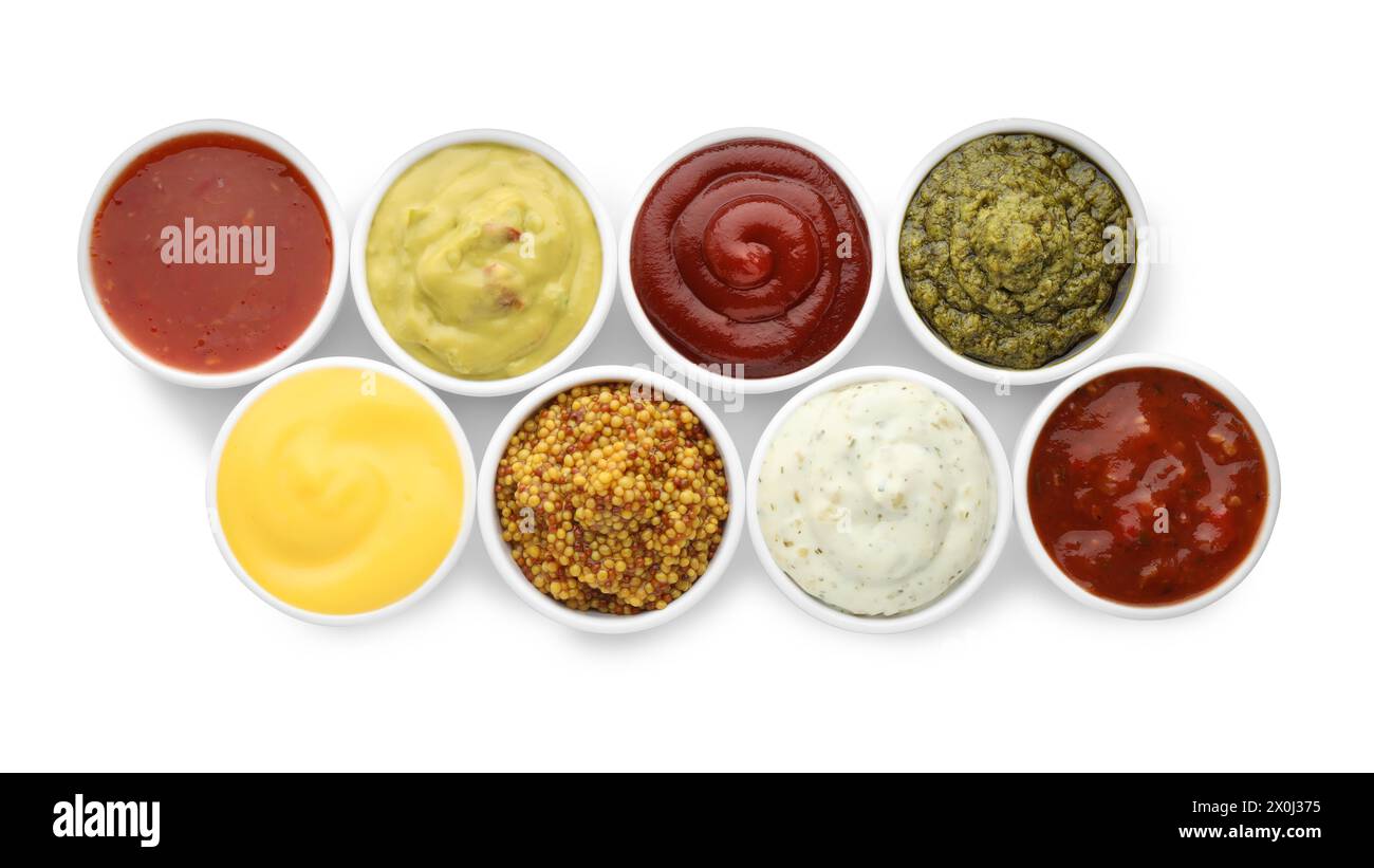 Many different sauces in bowls on white background, top view Stock ...