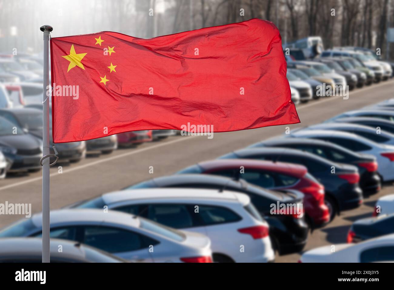 Chinese flag on a background of a lot of cars Stock Photo - Alamy