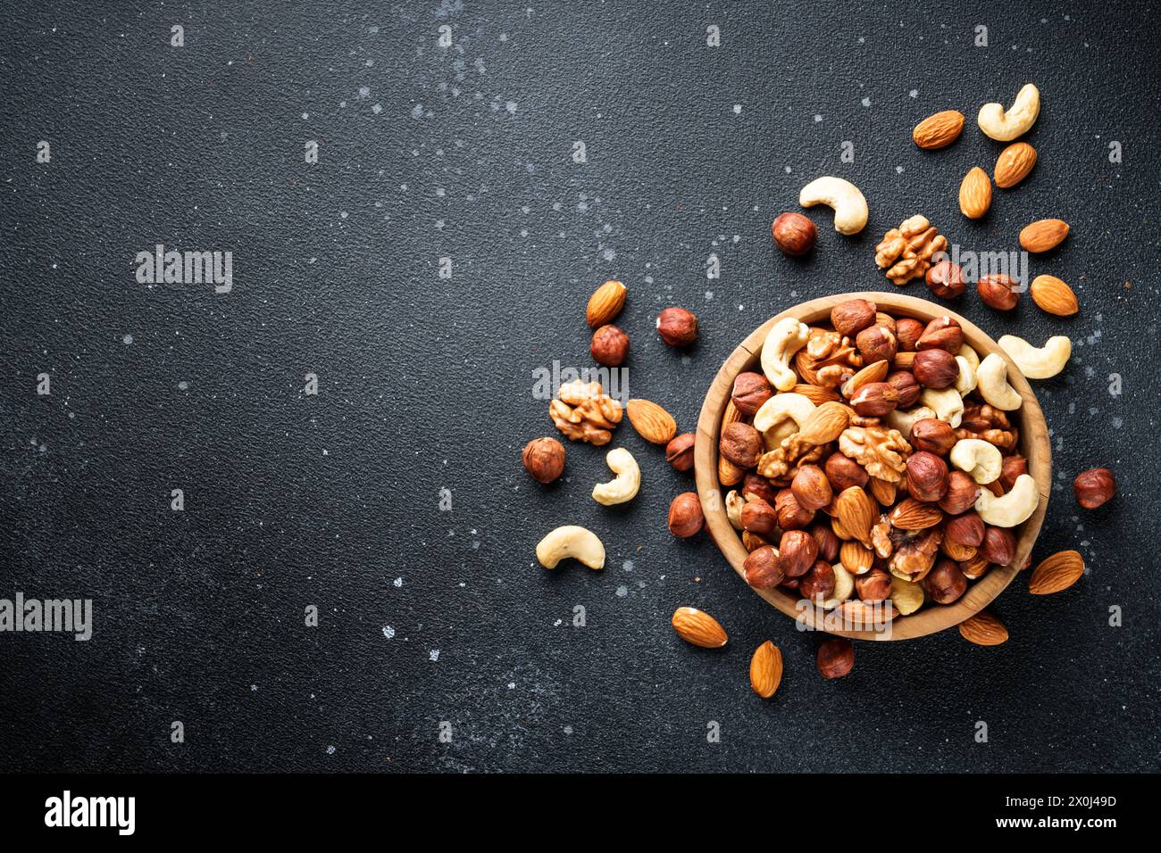 Nuts assortment at black background Stock Photo - Alamy