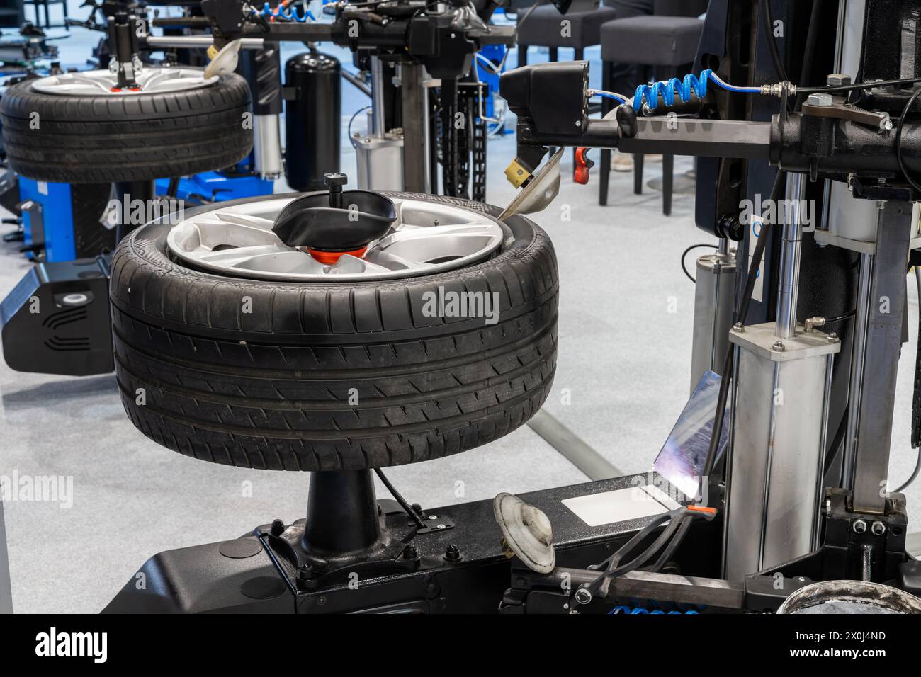 Car wheel balancing device for tire fitting Stock Photo - Alamy