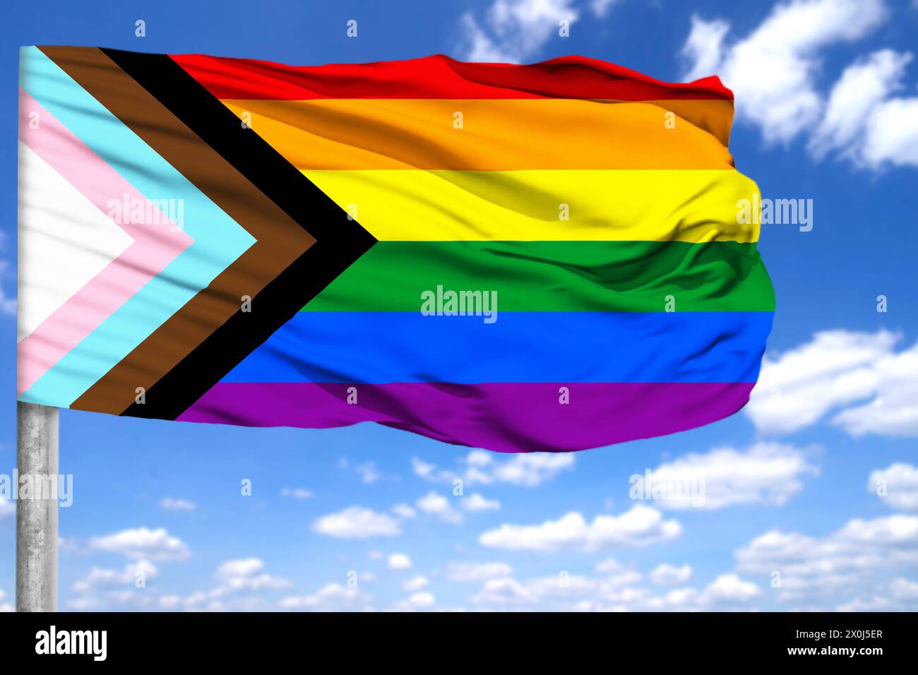 12 April 2024: Progress Pride flag in front of a blue sky. PHOTOMONTAGE ...
