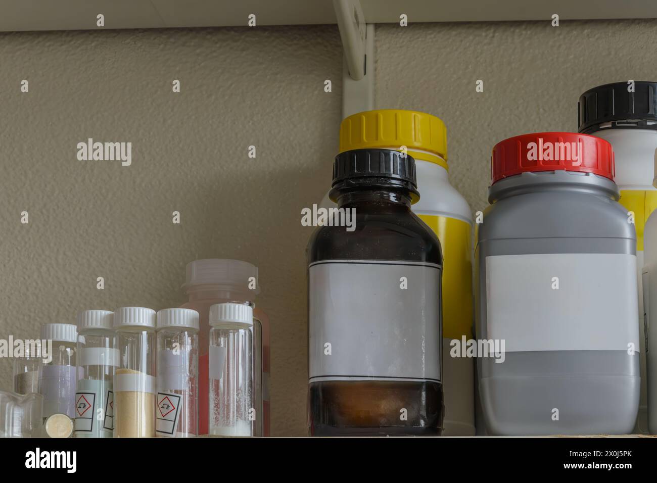 Shelf filled with various chemical bottles. Mockup Stock Photo - Alamy