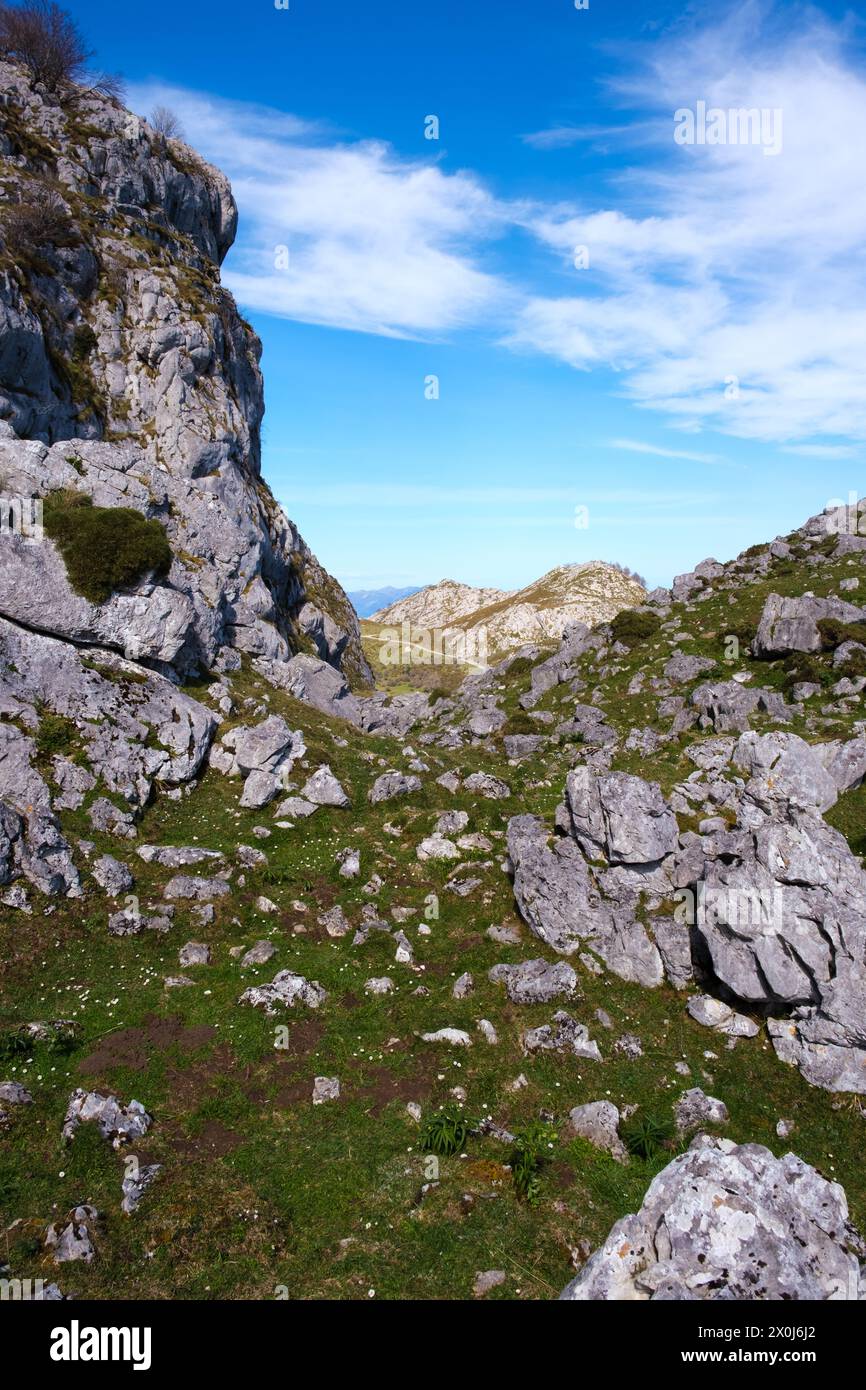 A rocky area with grass and rocks in the foreground, showcasing the ...