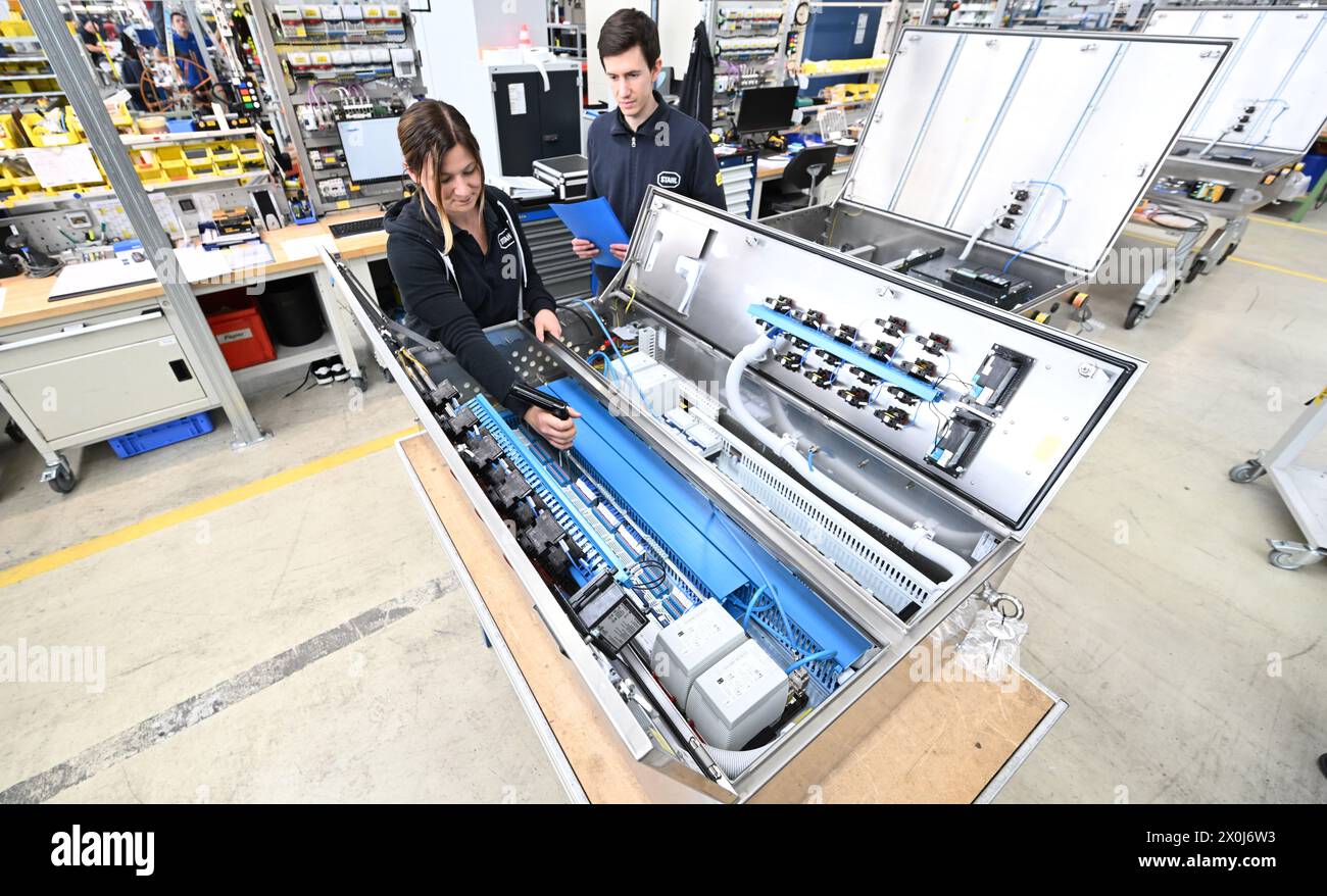 Waldenburg, Germany. 09th Apr, 2024. Workers manufacture explosion ...