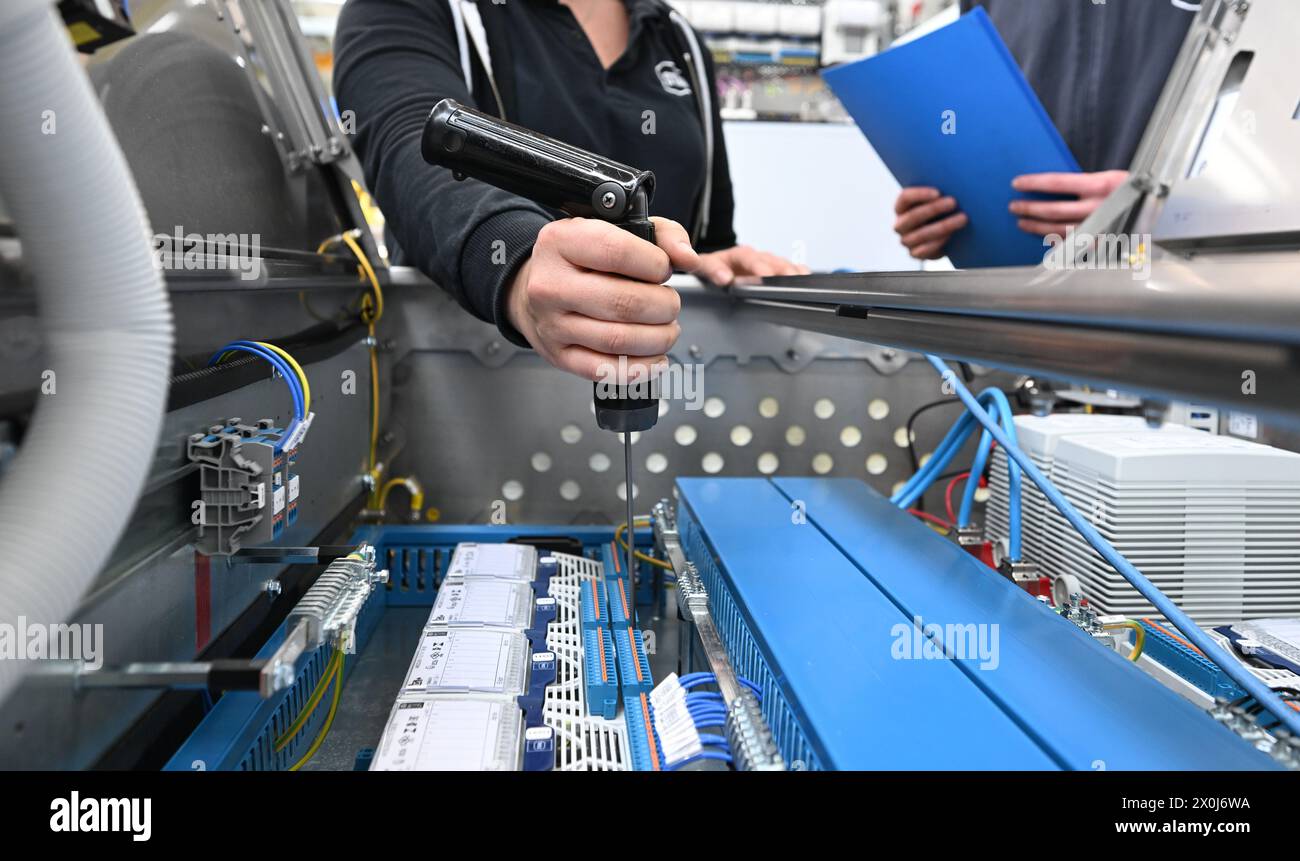Waldenburg, Germany. 09th Apr, 2024. Workers manufacture explosion ...