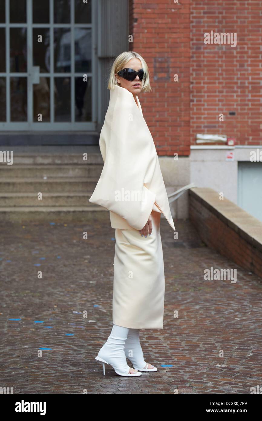MILAN, ITALY - FEBRUARY 23 , 2024: Violet Grace Atkinson with pale pink ...
