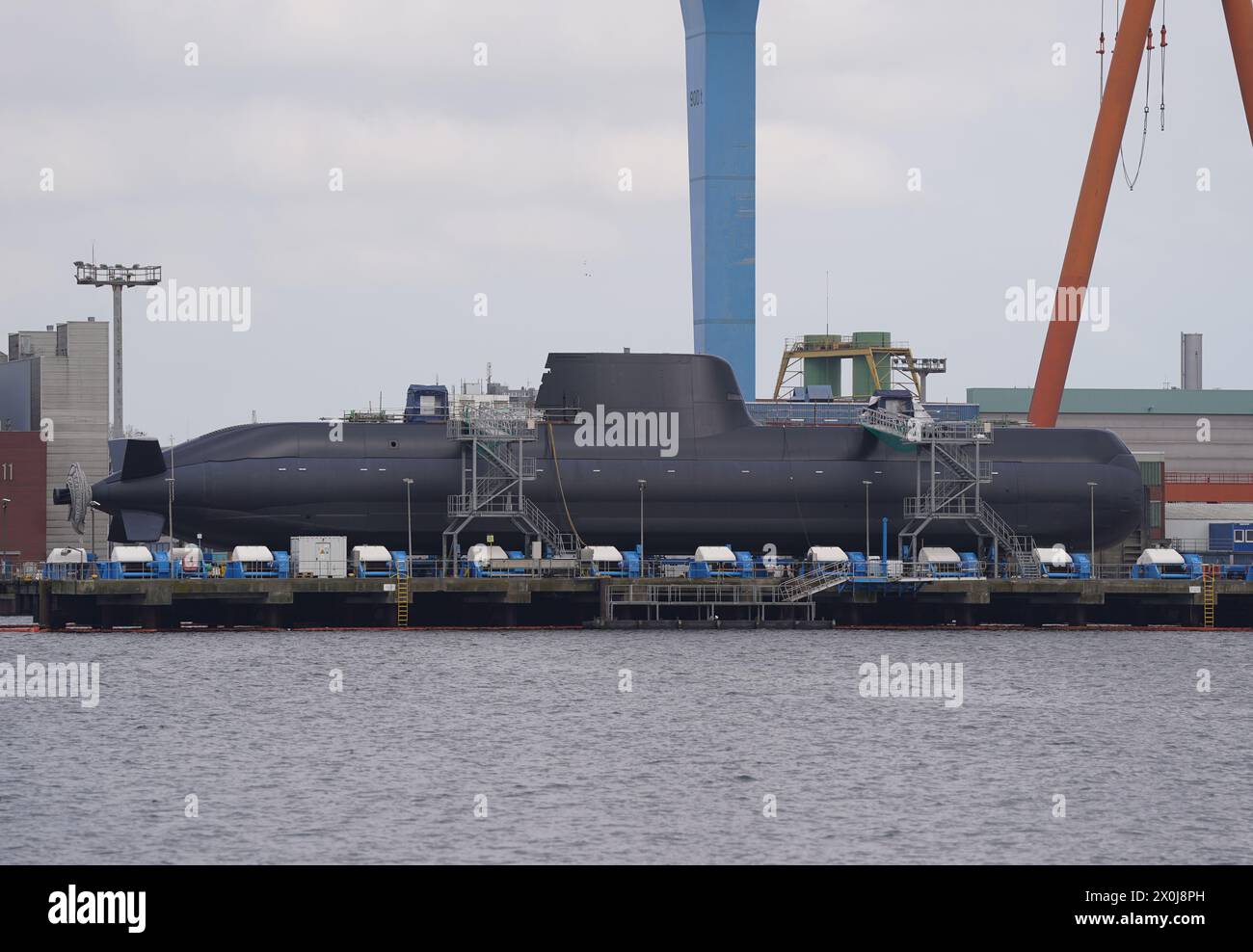 Kiel, Germany. 12th Apr, 2024. A submarine lies on the grounds of the ...