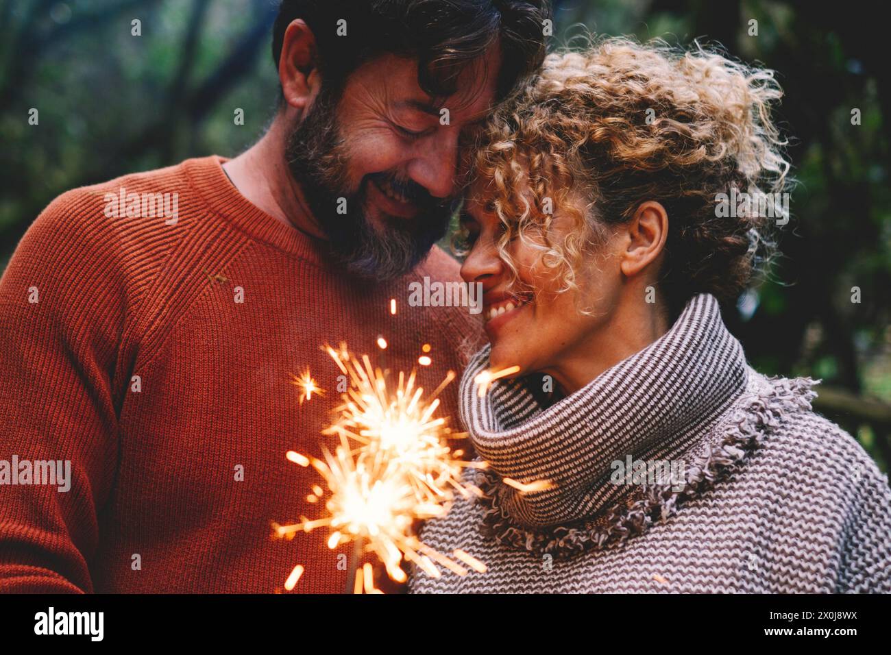Romantic adult couple enjoy and love together with fire sparkler light ...