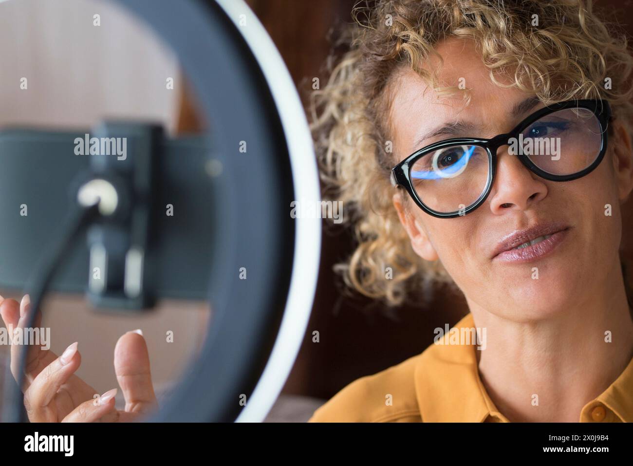 Modern job content creator adult pretty woman record video using mobile ...