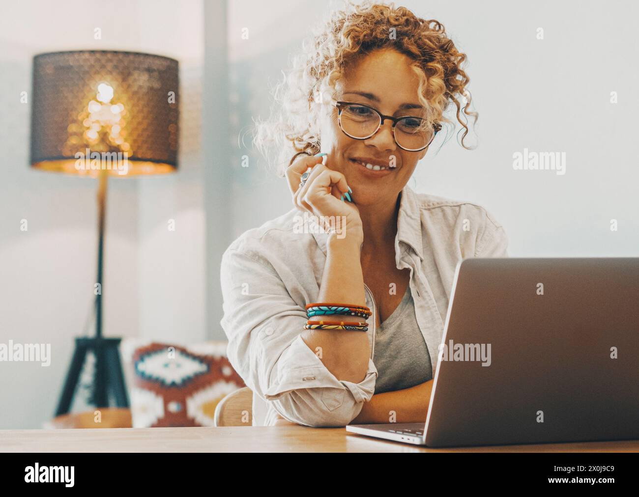 Modern business freelance woman work on laptop at home on the table ...