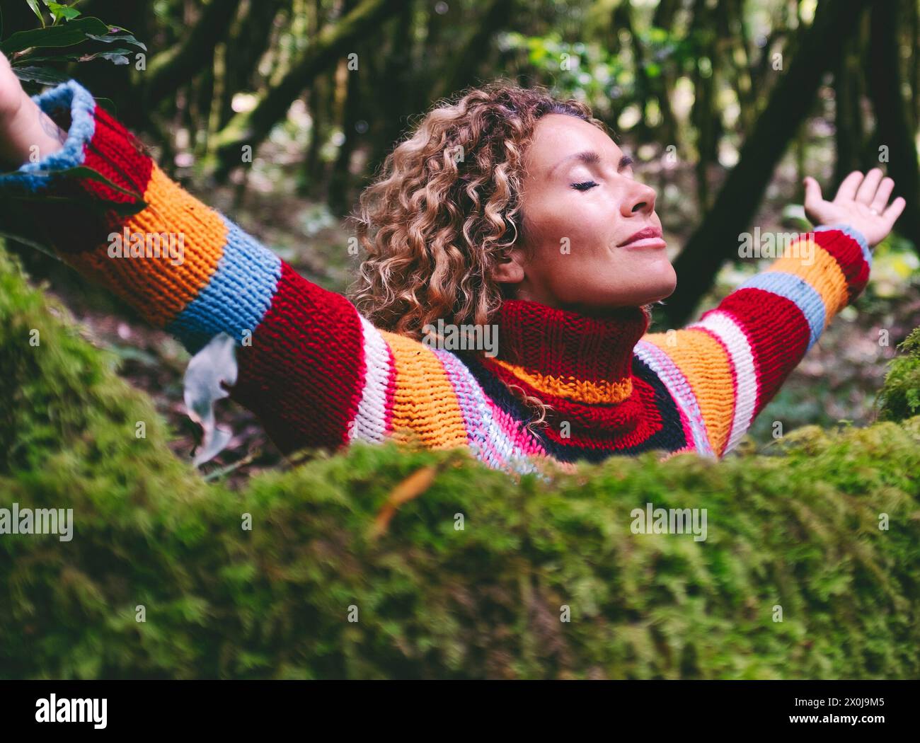 Profile of a relaxed woman breathing fresh air in a green forest ...