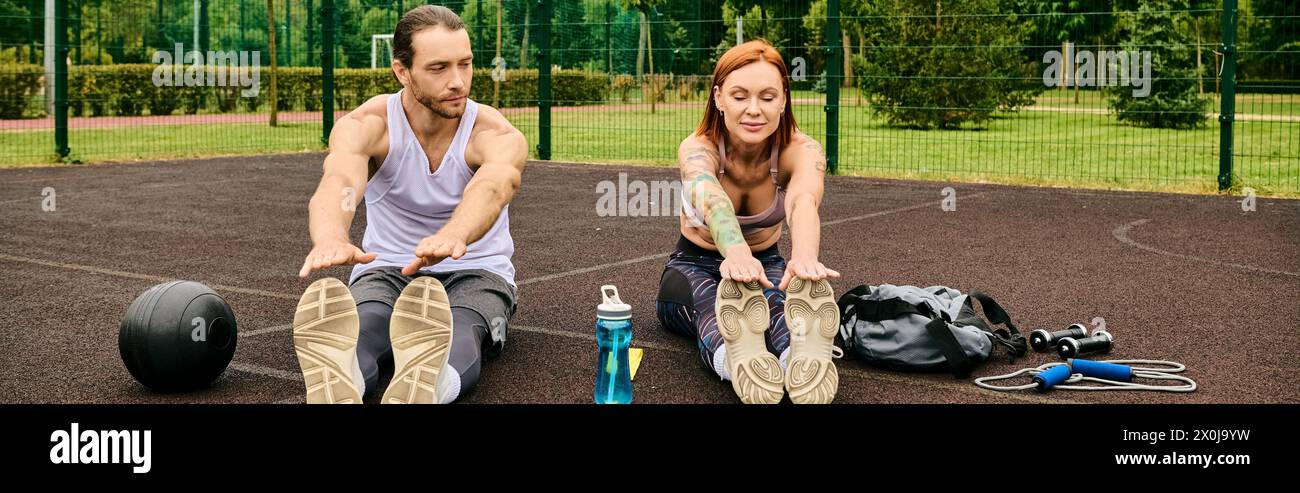 A woman in sportswear sit on a basketball court, driven by ...