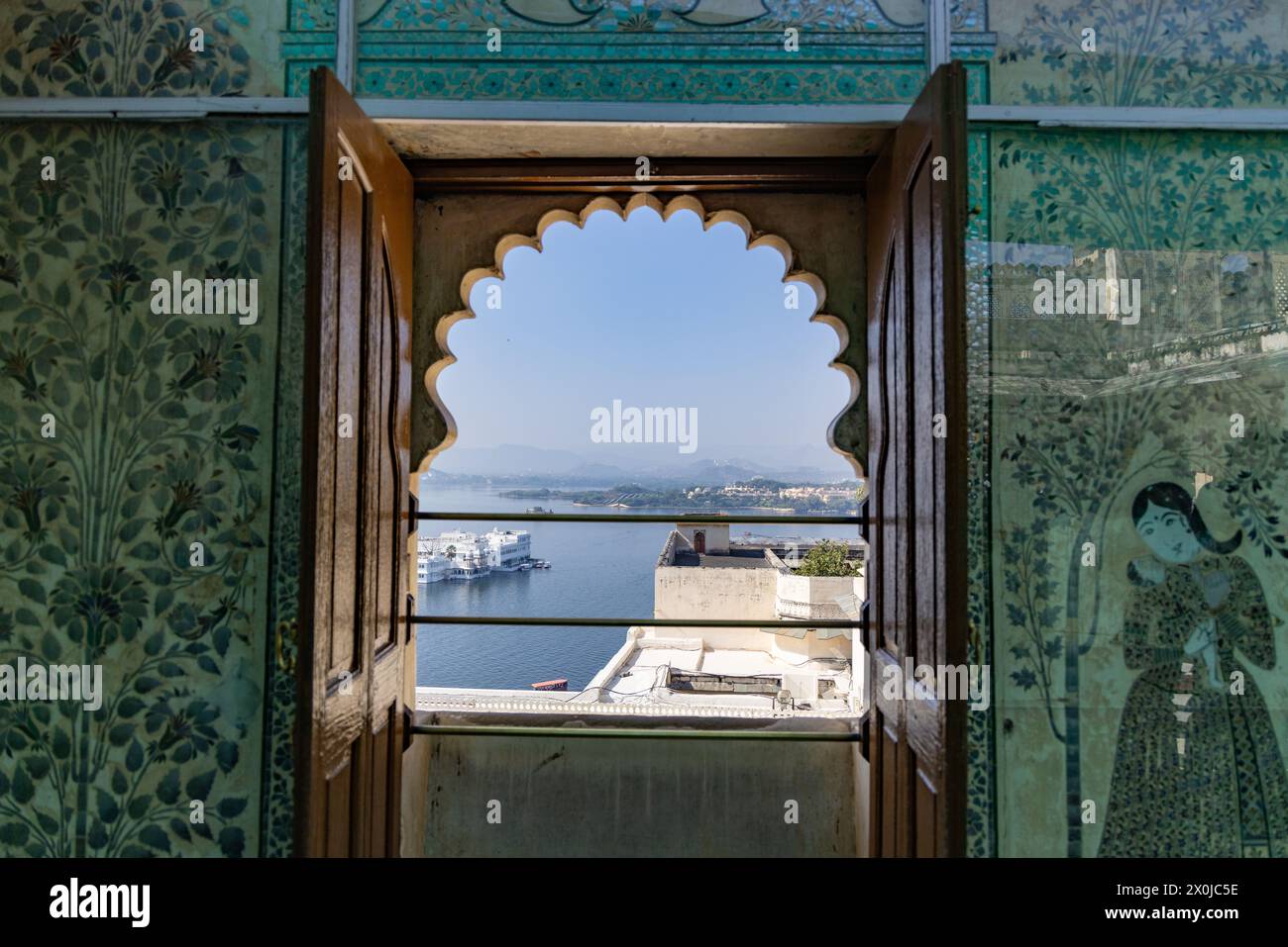View of Lake Pichola as seen through a window of Udaipur City Palace ...