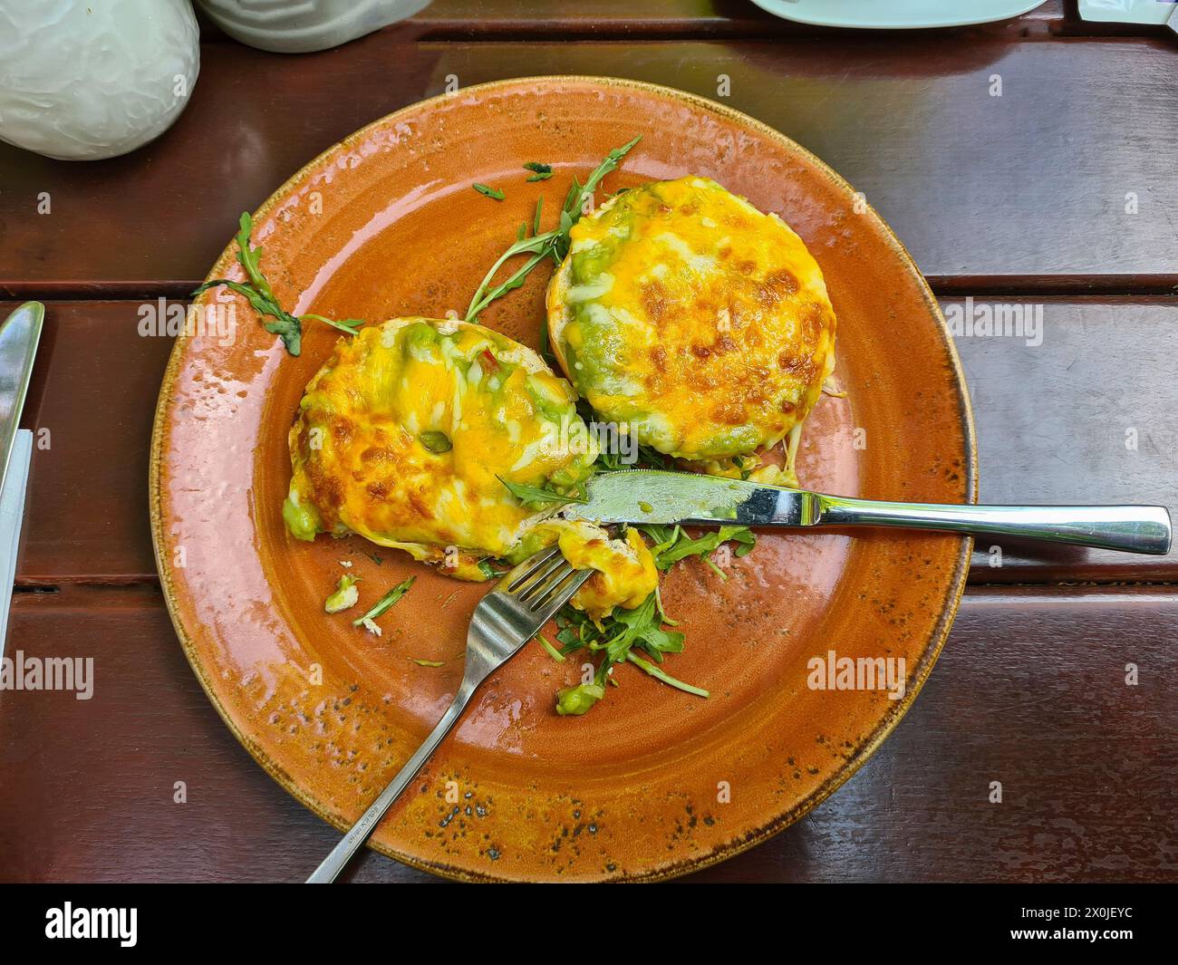 Bread roll halves topped with cheese hi-res stock photography and ...