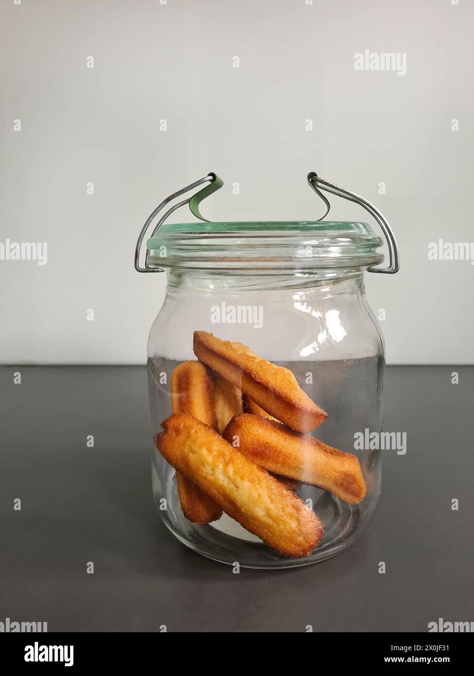 Preserving jar for storing the madeleine pastry Stock Photo - Alamy