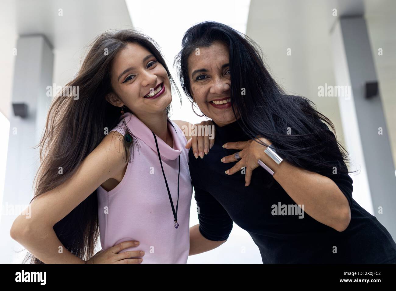 Two adult Latin American women mother and daughter with positive ...