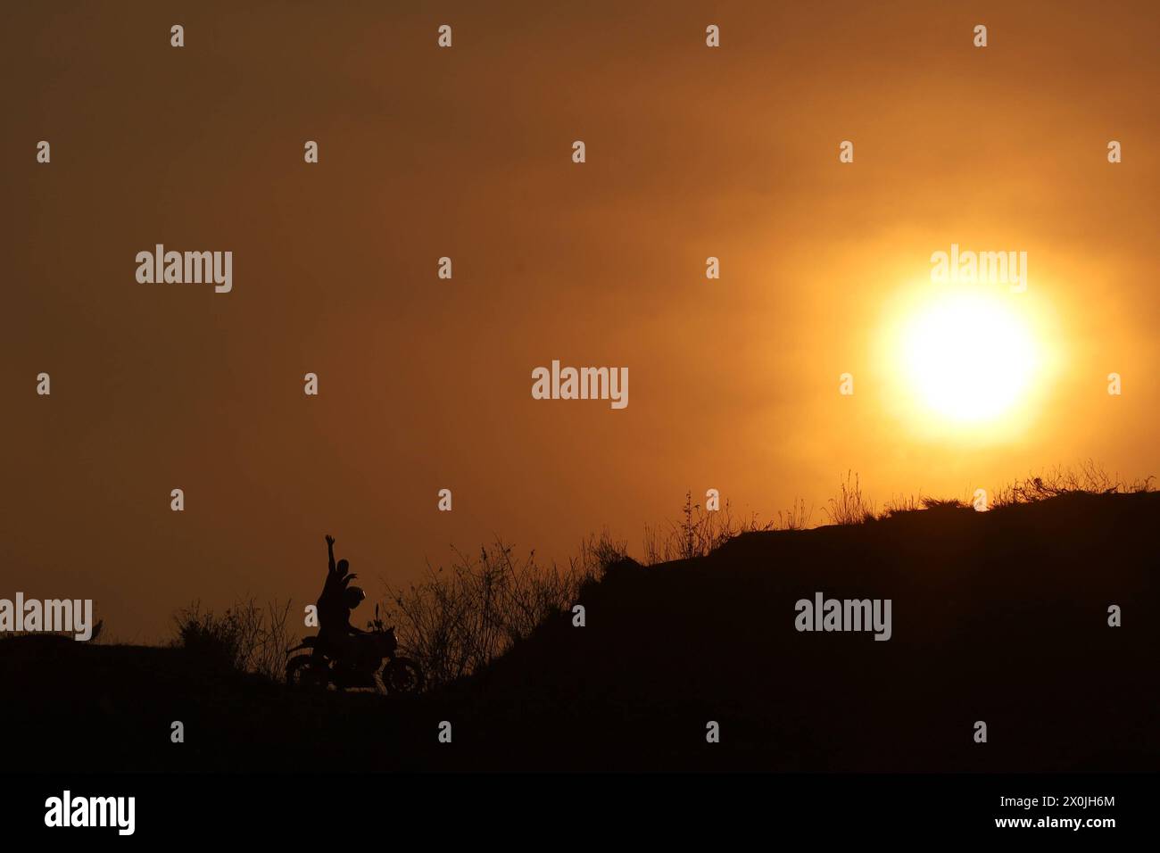 Last sunset of Nepali Year 2080 BS Bikers riding against the background ...