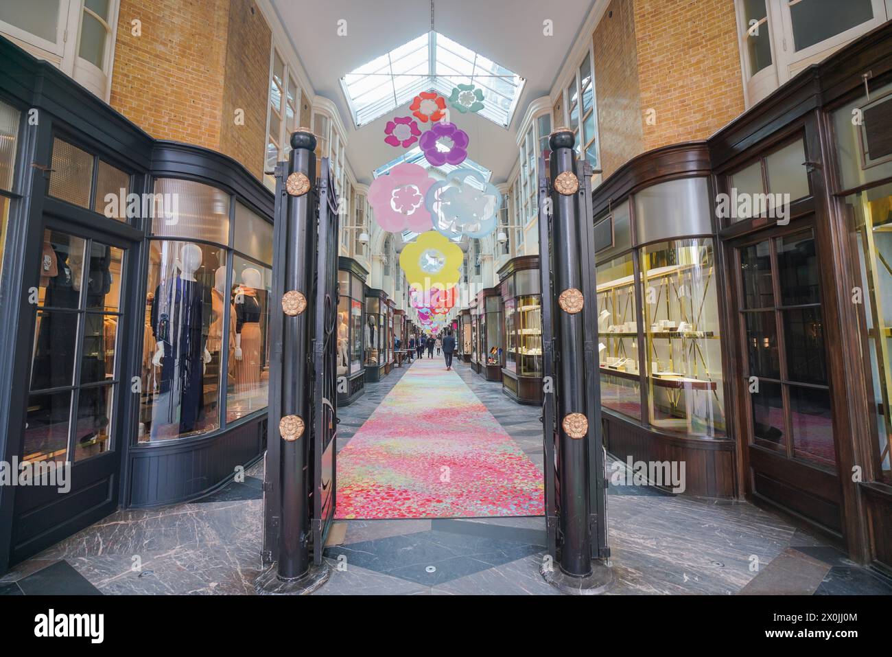 London 12 April 2024 . Rosette flowers decorate the Burlington Aracade ...