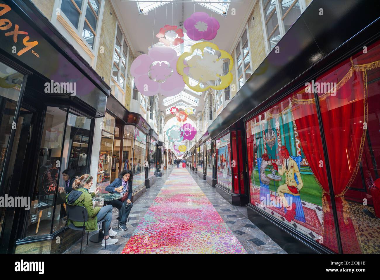 London 12 April 2024 . Rosette flowers decorate the Burlington Aracade ...