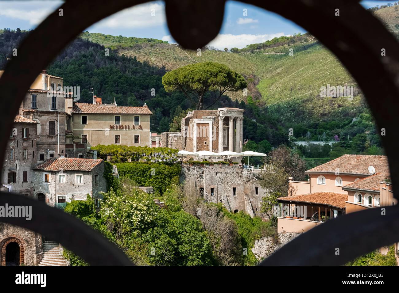 the temple of the Sibyl of Tivoli seen from a panoramic point through a ...