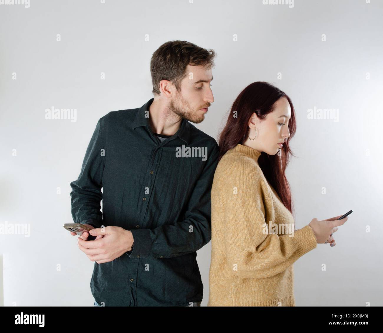Jealous girl looking couple hi-res stock photography and images - Alamy