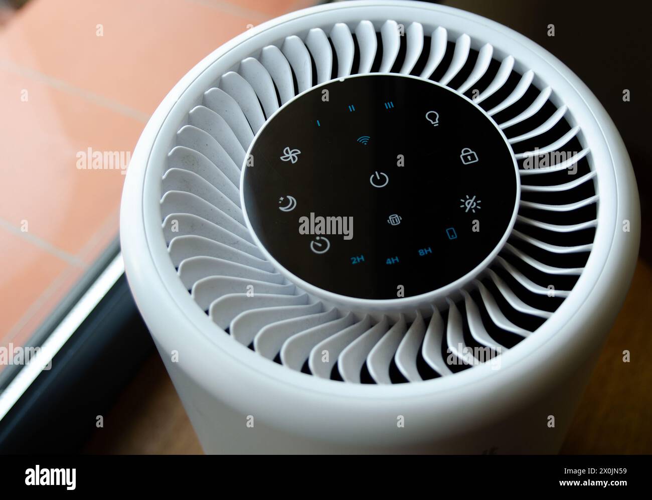 Air purifier next to the window to clean and refresh the air Stock ...