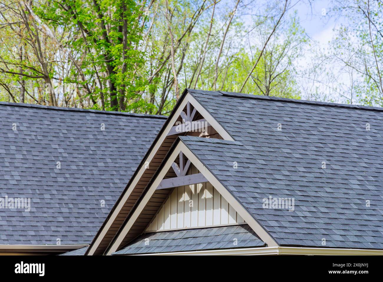 Roofing shingles cover roof top of newly constructed house Stock Photo ...