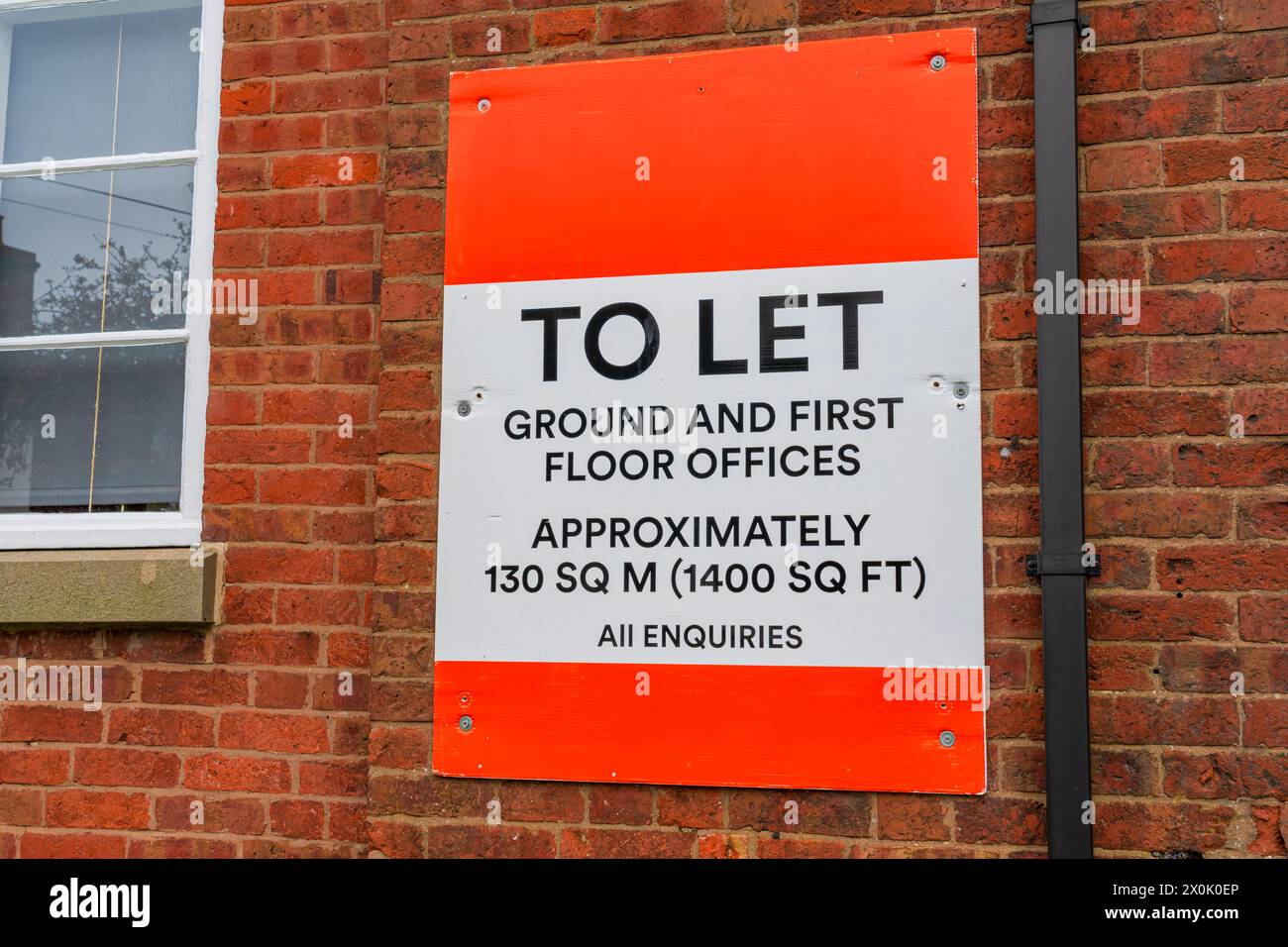 To let offices board sign on the side of a building Stock Photo - Alamy