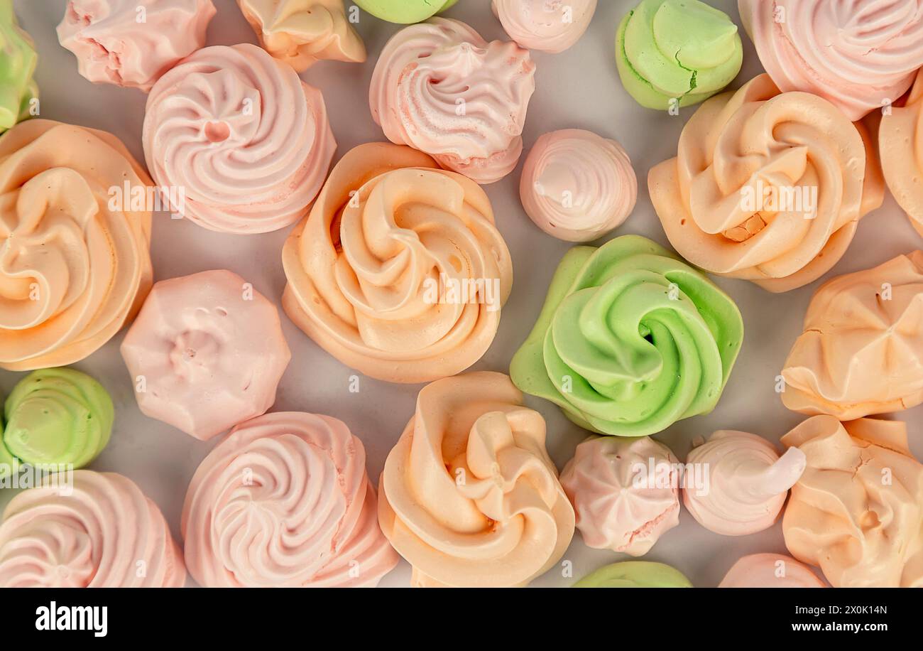 A background of colored meringues laid out next to each other Stock ...