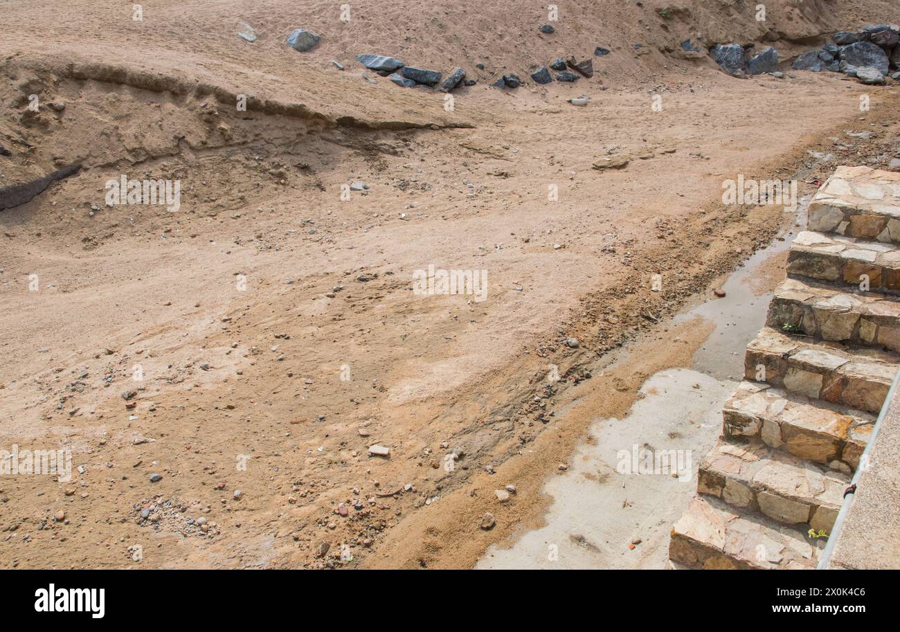 Sand, stones and ladder on the building or pit in Spain. Nature texture ...