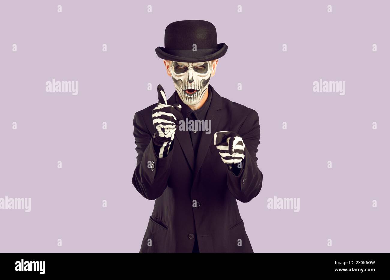 Horror movie character shoots at viewer with imaginary guns Stock Photo ...