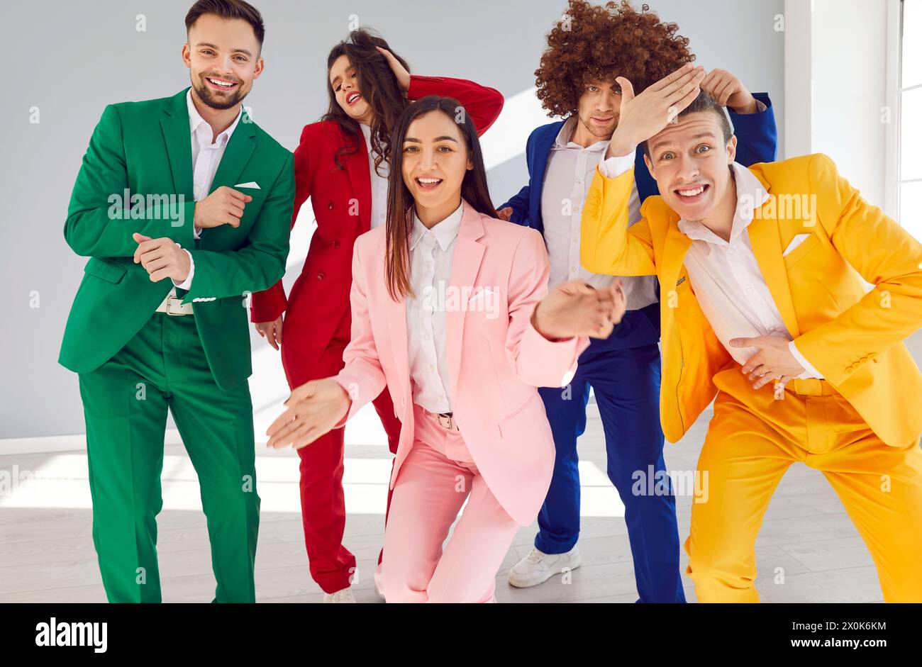Happy bright group, entertaining people in vibrant vivid formal suit ...